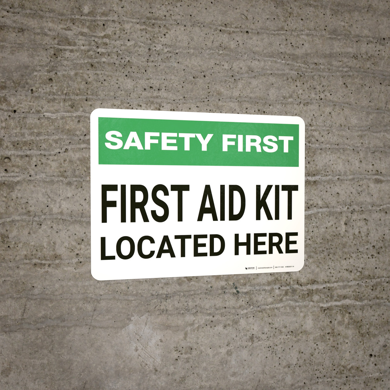 Safety First: First Aid Kit Located Here - Wall Sign