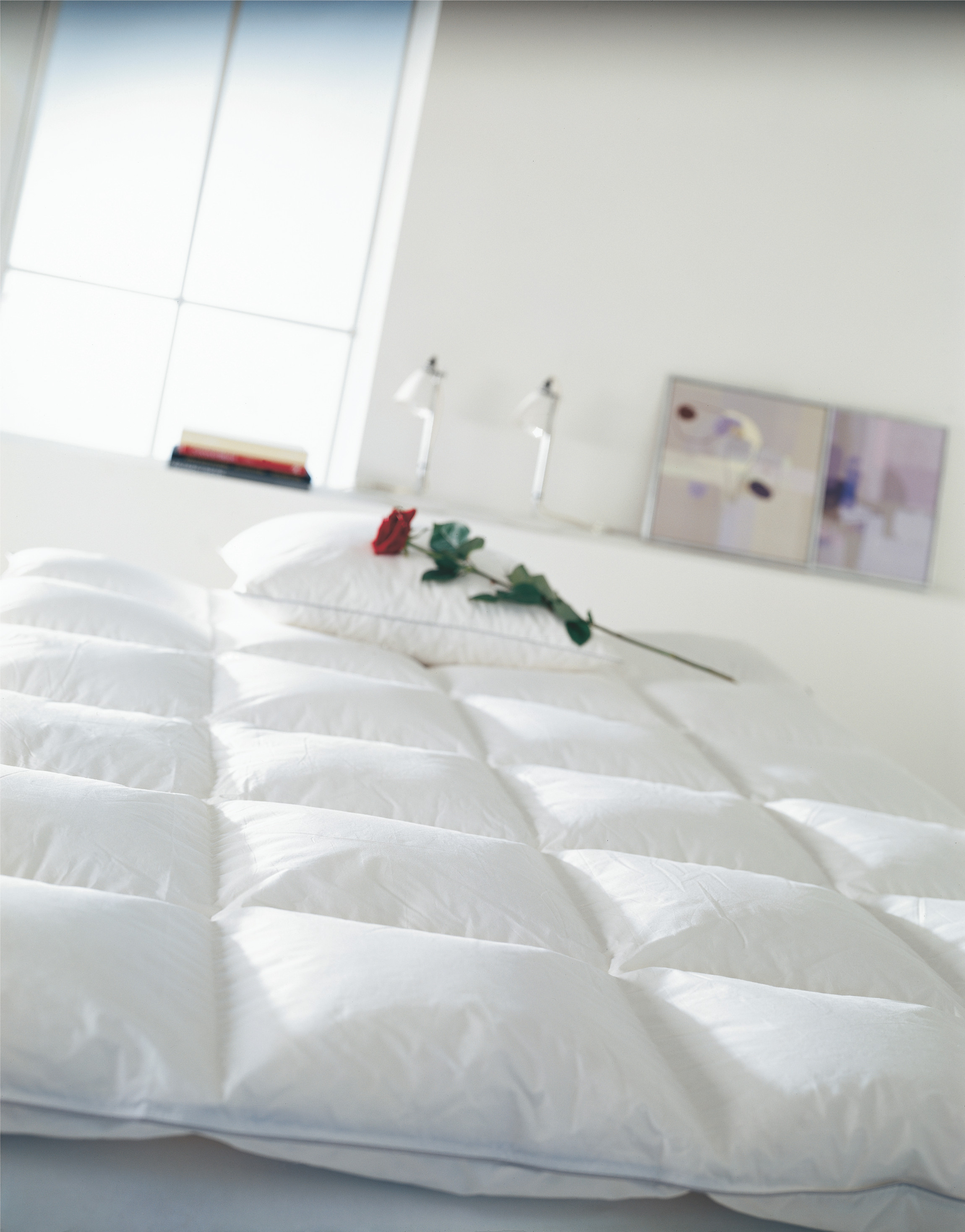 two comforters on one bed