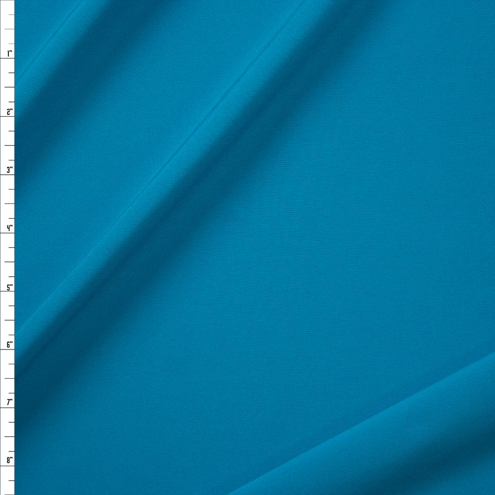 Cali Fabrics Turquoise Blouse Weight Stretch Polyester Woven Fabric by ...