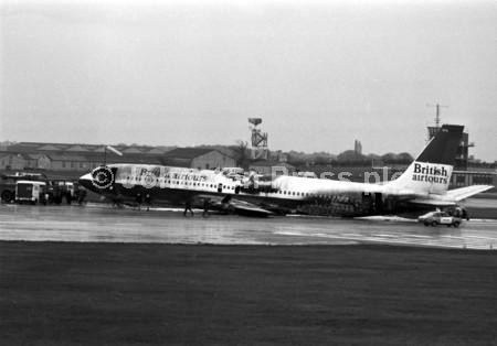 20243019-A fire crew checks the damage to a British airtours Boeing 707 ...