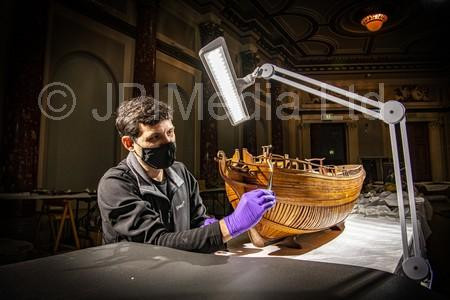 38978833-14 May 2021. . . . . Conservator Stathis Tsolis works on model ...