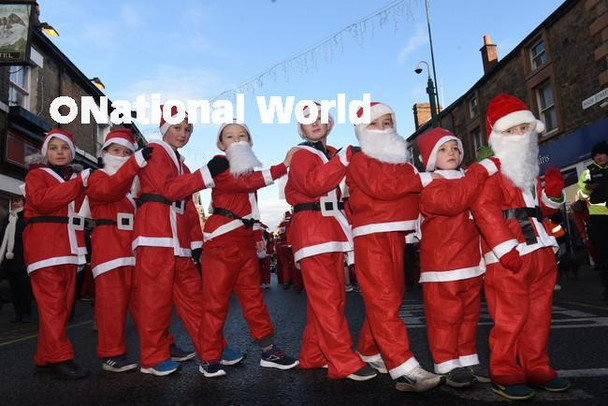 39627068-Photo Neil Cross; The Garstang Santa Dash turns into a Santa ...