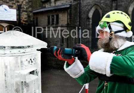 38877947-Richard Spence dressed as an elf finishing off the ice post ...