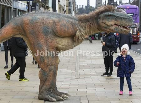36072884-22 03 2018. A life size, roaming dinosaur prowled the streets ...