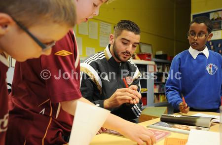 29227702-JP License Dalry Primary School Pic Caption: Alim Ozturk signs ...