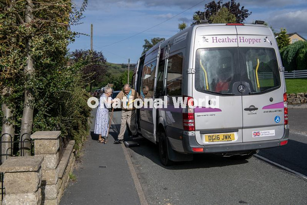 39859582-Passengers disembark The Heather Hopper community bus serving ...