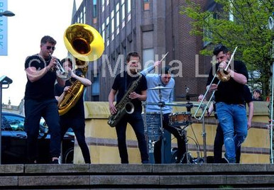 39426772-The Leeds based Hyde Park Brass Band performing at the ...