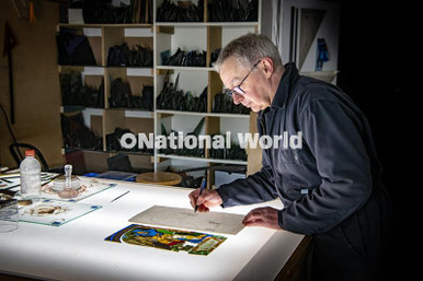 40367159-Stained glass conservator Jonathan Cooke restoring a small ...