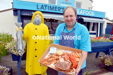 40377230-Latimer's Seafood owner Robert Latimer with Donald the ...