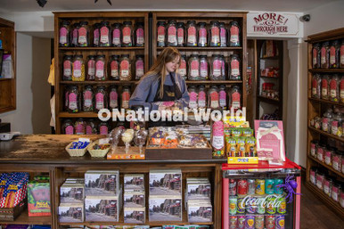 40385708-Assistant manager Hannah Morris weighing out confectionary ...