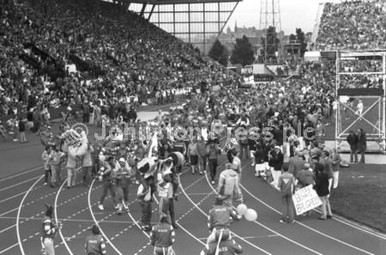 20385742-Athletes andbsupport staff spill on the track at the informal ...