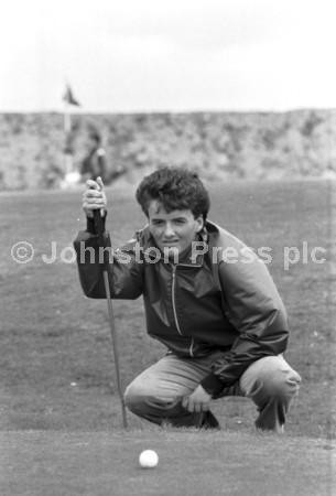 22642242-Golfer Stuart Bannerman lines up a putt during round one of ...
