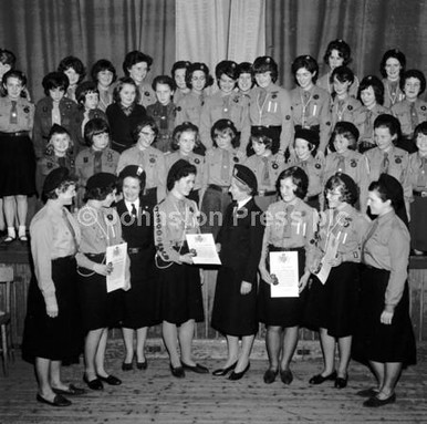 23444947-Four members of the 156th Company of Girl Guides receive their ...