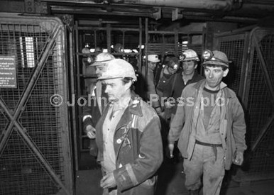 22655142-Dejection on the faces of Fife miners, leaving the cage for ...