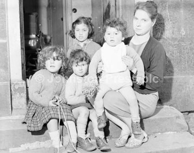 23446259-Mrs E Pandit with her children outside her home in Salisbury ...