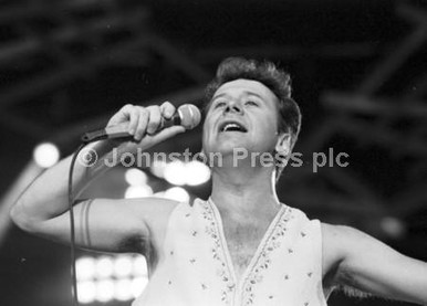 22701152-Singer Jim Kerr on stage in a Simple Minds concert at ...