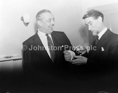 20879894-Duncan Macrae and French actor Jacques Tati at a reception at ...