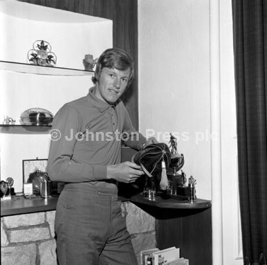 20236103-Hearts football player Dave Clunie at home, holding one of his ...