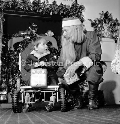20236366-A wee boy meets Santa at Patrick Thomson department store in ...