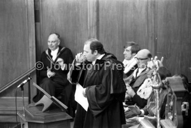 20240597-Author and humourist Alan Coren stops for a drink of water ...