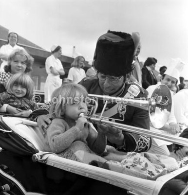 20242566-Christopher Adair 2 tries out bandsman Terry Wakefield s ...