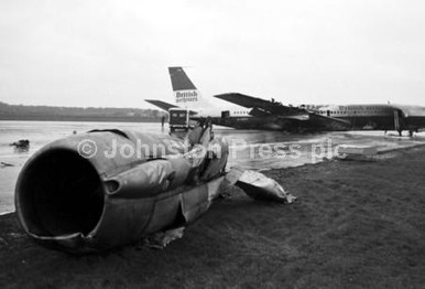 20243025-A fire crew checks the damage to a British airtours Boeing 707 ...