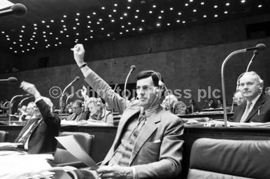 20244098-John Corrie MEP wearing headphones in the European Parliament ...