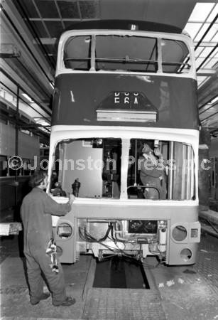 22561186-Two men working on a new bus at Walter Alexander & Co ...