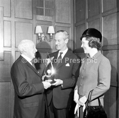 20364094-Frank Moran present the golf trophy named after him to Charles ...