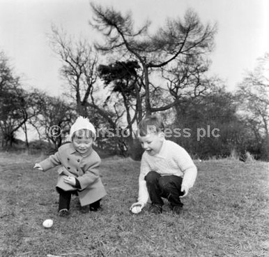 20364365-Little boys rolling eggs at Easter time in April 1969 - l-r ...
