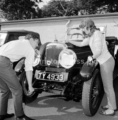 20364866-Mr Scott and fiancee give a car the once over during the ...