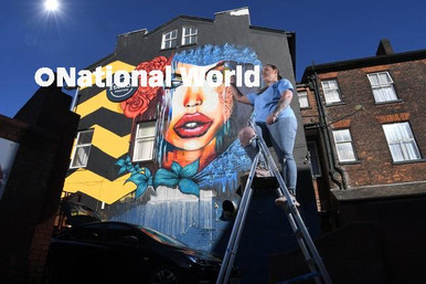 39575267-Photo Neil Cross; Olivia Hayes with the new mural at The ...