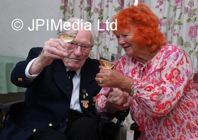 39592955-Photo Neil Cross; 104 year old Ernest Horsfall receiving a ...