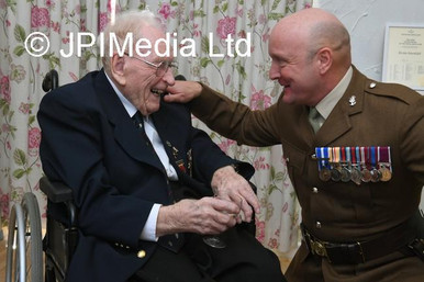 39592964-Photo Neil Cross; 104 year old Ernest Horsfall receiving a ...