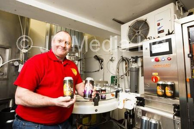 38963971-Steve Hemingway with the new canning machine at Mill Valley ...