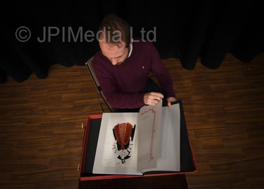 39612057-Ben Elliott of Tennants is pictured with Books Maps and ...