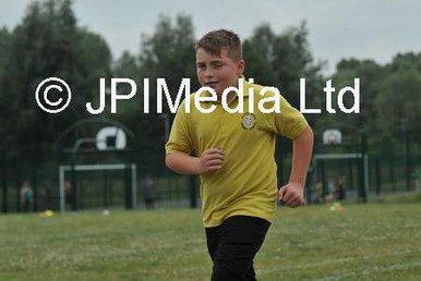 39039690-WIGAN - 02-07-21 - The Wigan Runner, Matthew Melling, holds a ...