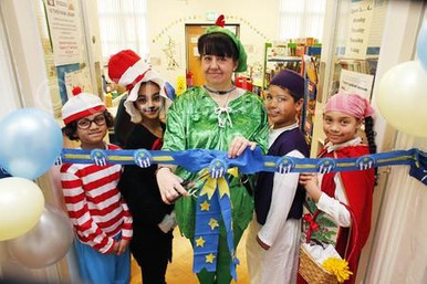 38905435-Kids in fancy dress to celebrate opening of new library at the ...