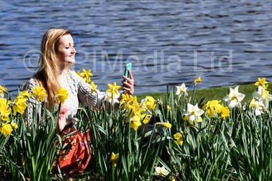 38937984-Cat Thomson from Leeds in Roundhay Park checking Tik Tok on ...