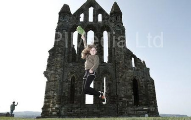 38934094-Whitby Abbey visitor Lucy leaps with joy at the Abbey opening ...
