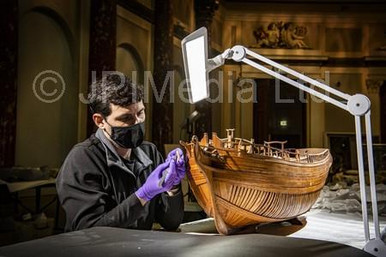 38978830-14 May 2021. . . . . Conservator Stathis Tsolis works on model ...