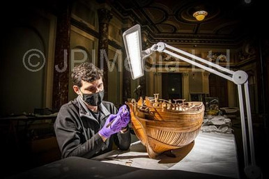 38978832-14 May 2021. . . . . Conservator Stathis Tsolis works on model ...