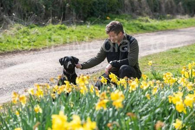 39409135-Adam Hayward and his young Labrador Ember at Cold Harbour Farm ...
