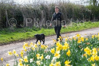 39409139-Adam Hayward and his young Labrador Ember at Cold Harbour Farm ...