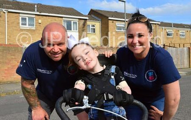 39008467-Tilly Grant on her specially adapted bike with Micky Day and ...