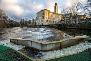 38869901-The view of Salts Mill from Roberts Park across the weir and ...