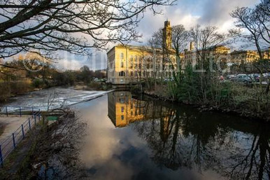 38869902-The view of Salts Mill from Roberts Park across the weir and ...
