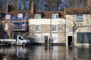 38884844-22 January 2021. . . . . Residents look at the flood water ...