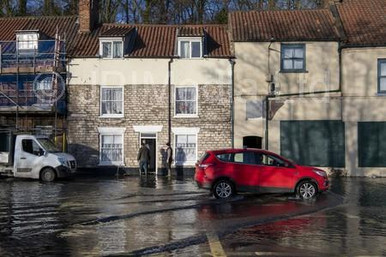 38884845-22 January 2021. . . . . Residents look at the flood water ...