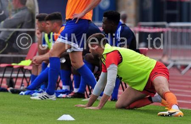 39065244-Players on the bench waiting for 2nd half action. Action from ...